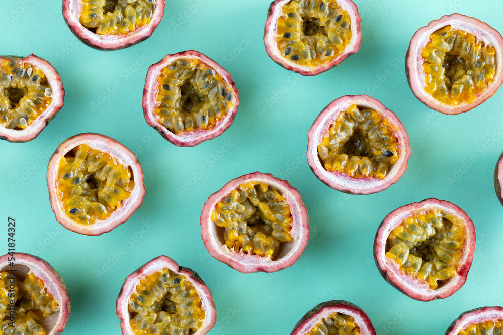 Pattern of juicy sweet and sour passion fruit on a blue background ...
