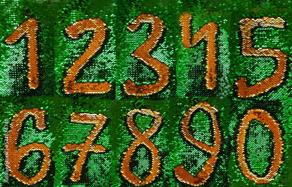 numbers sequins. Golden sequins numbers on green sparkling sequins ...