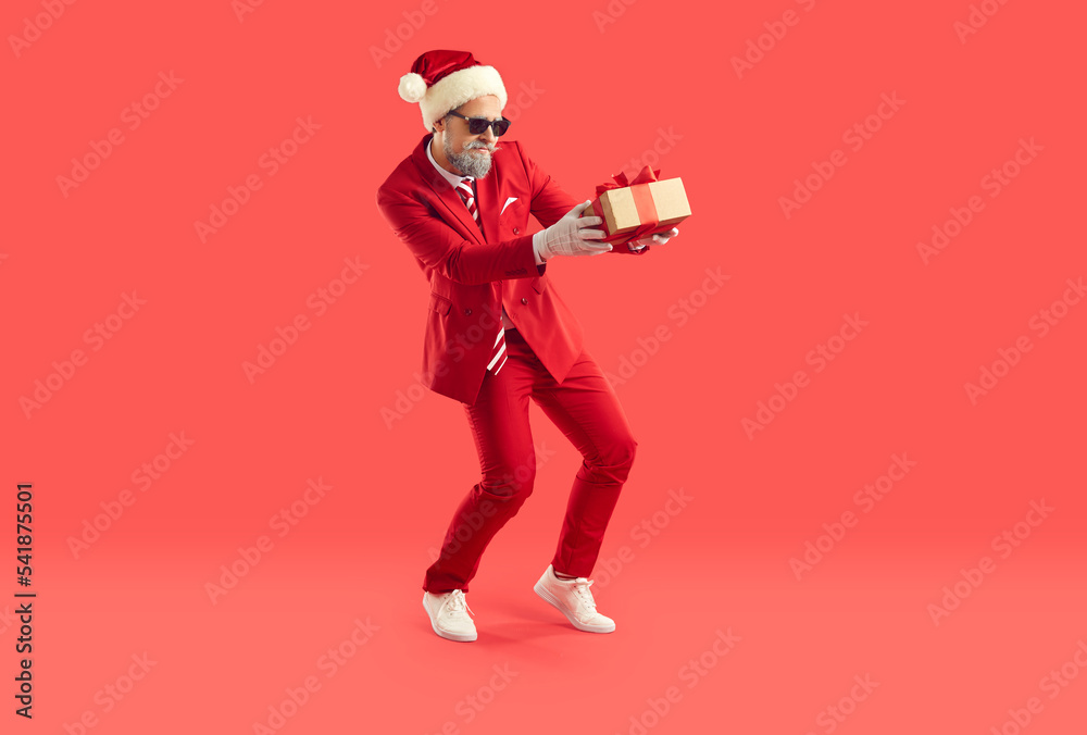 Funny guy wants to leave surprise under Christmas tree. Sneaky man in ...