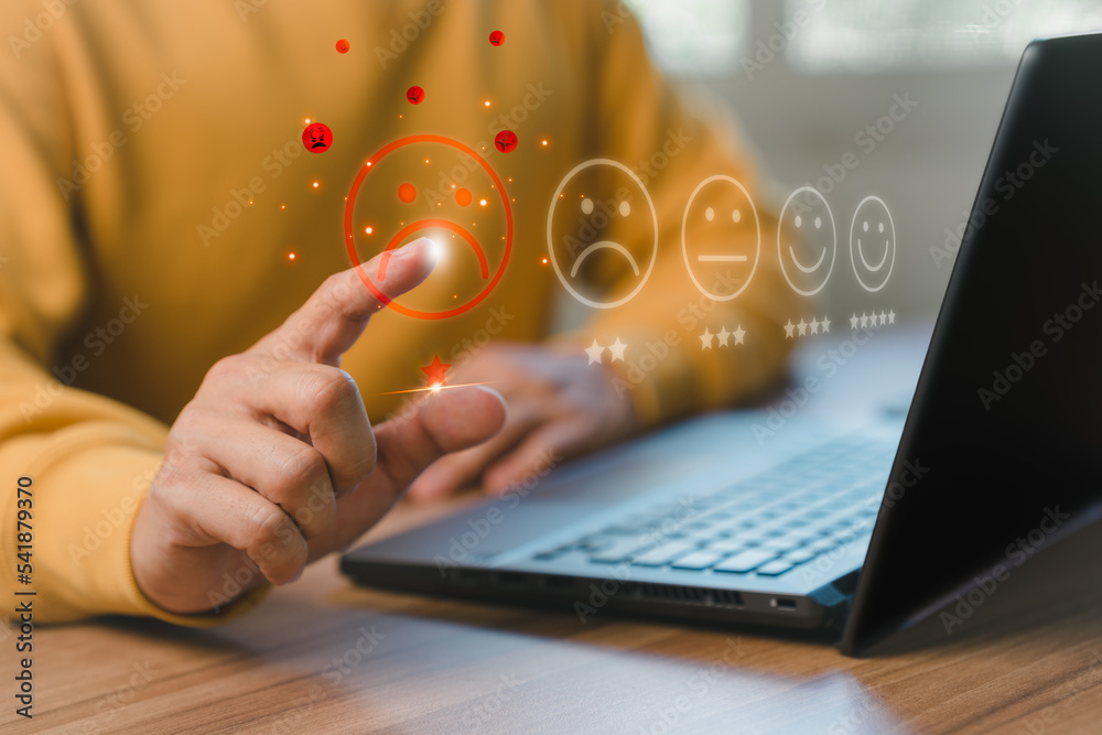 Unhappy man customer with sad emotion face on laptop. Bad review and ...