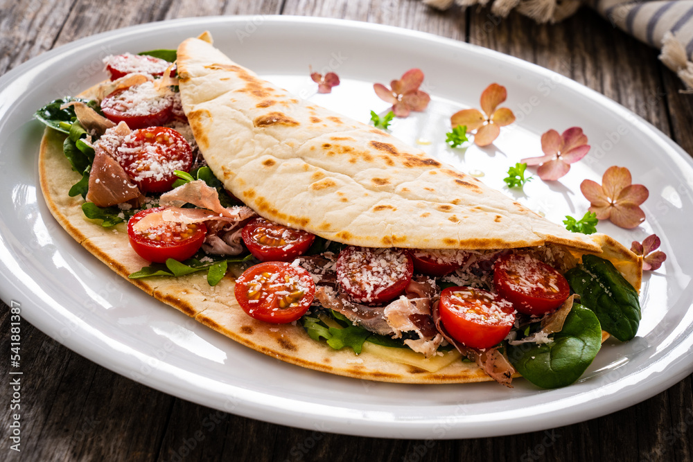 Italian piada wraps - piadina stuffed with fresh vegetable leaves ...