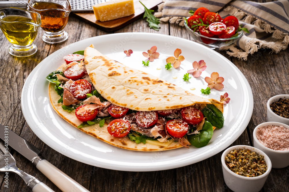 Italian piada wraps - piadina stuffed with fresh vegetable leaves ...