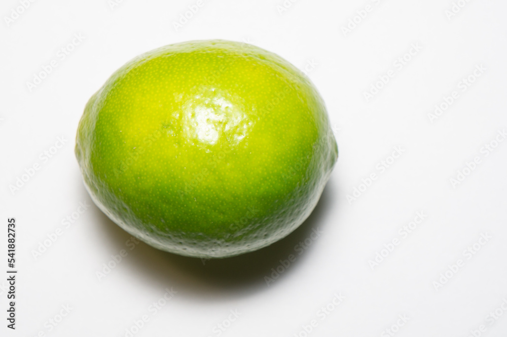 Yellow green lemon on a white background Stock Photo | Adobe Stock