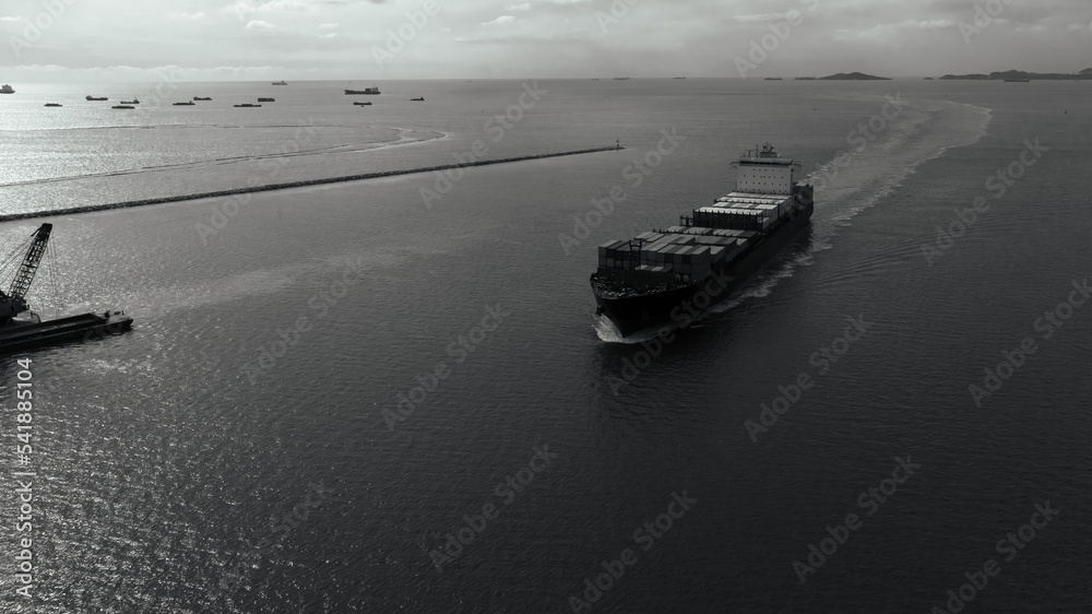 black and white cargo container ship full speed sailing in sea import ...