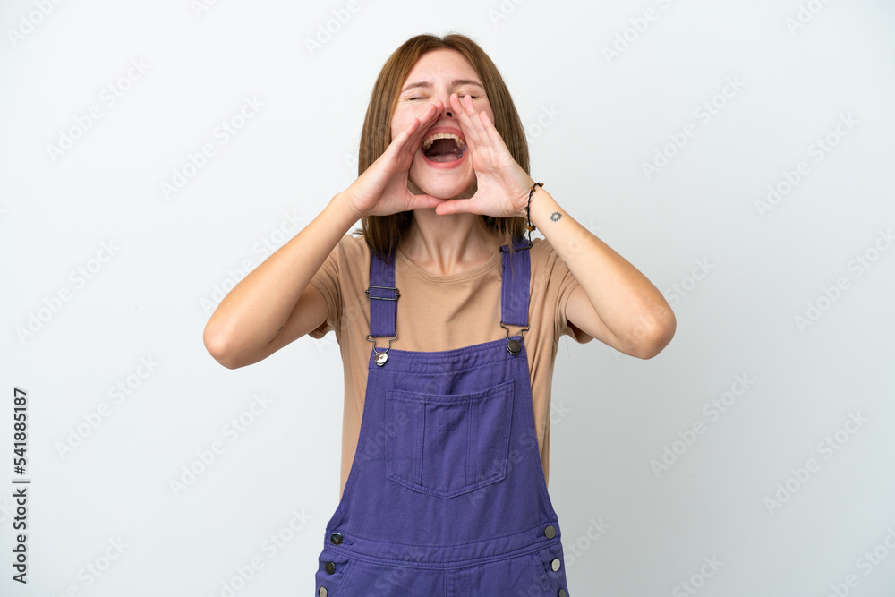 Young English woman isolated on white background shouting and ...