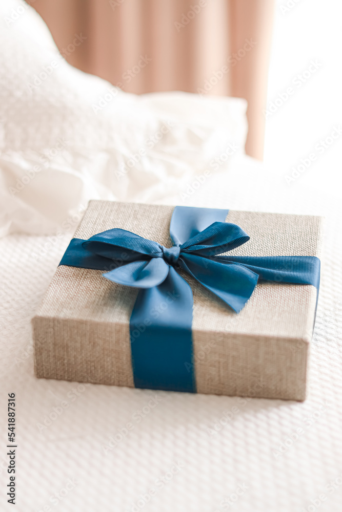 Holiday present and luxury online shopping delivery, wrapped linen gift ...
