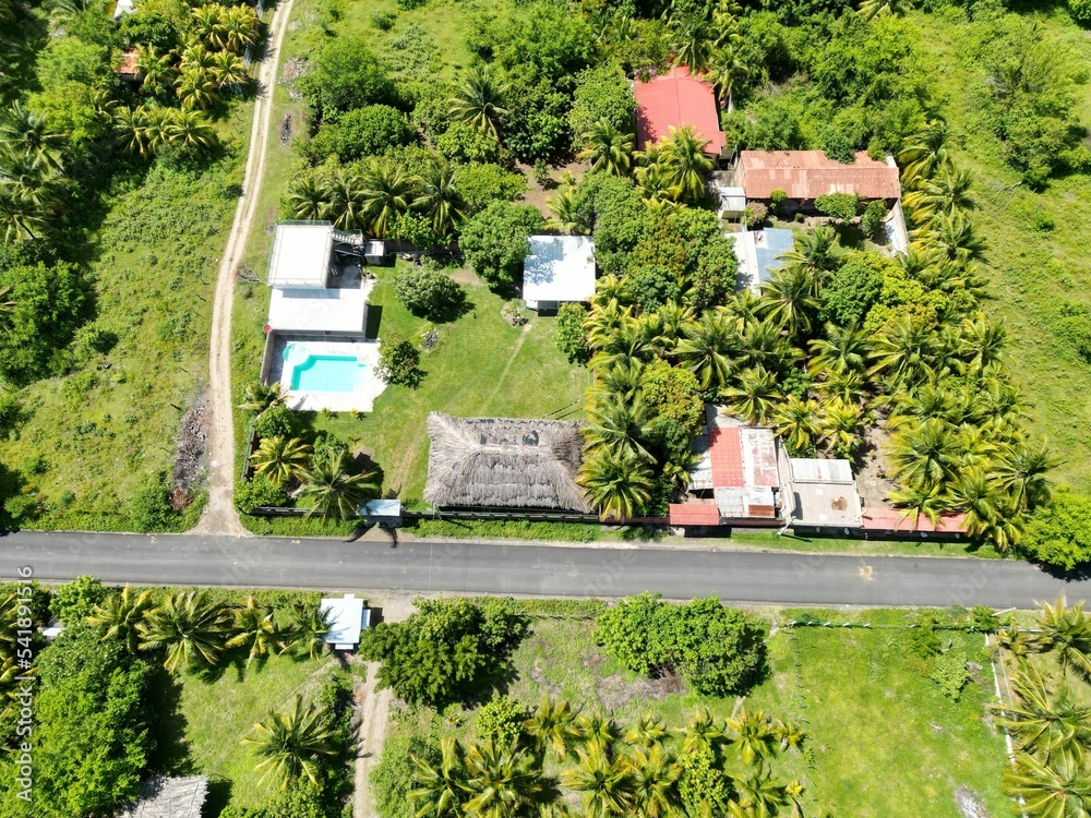 Drone view of resort houses in the green Playa El Espino beach ...