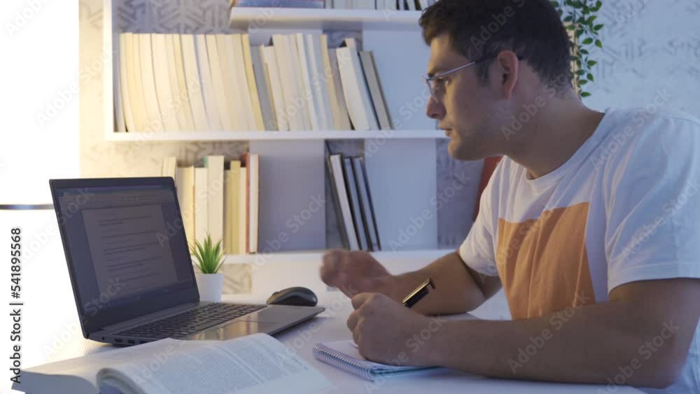 College student working on laptop. University student studying. Stock ...