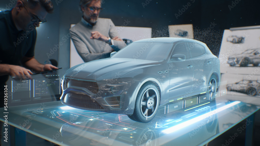 Two male engineers using digital tablet App, developing 3D model of a ...