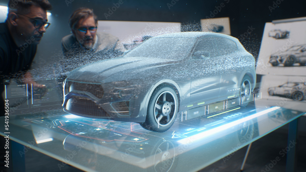 Two male engineers using digital tablet App, developing 3D model of a ...