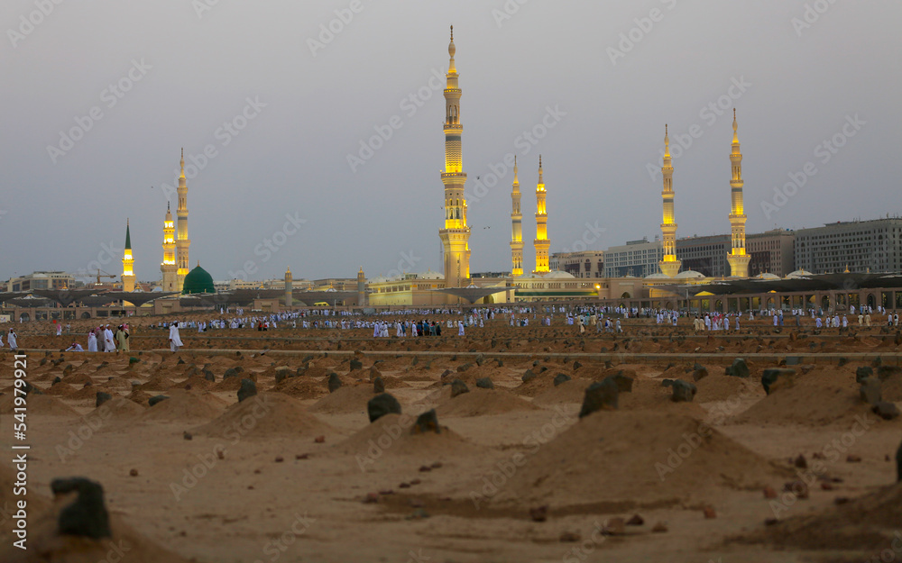 Muslim pilgrims visiting the beautiful Nabawi Mosque, and green dome of ...