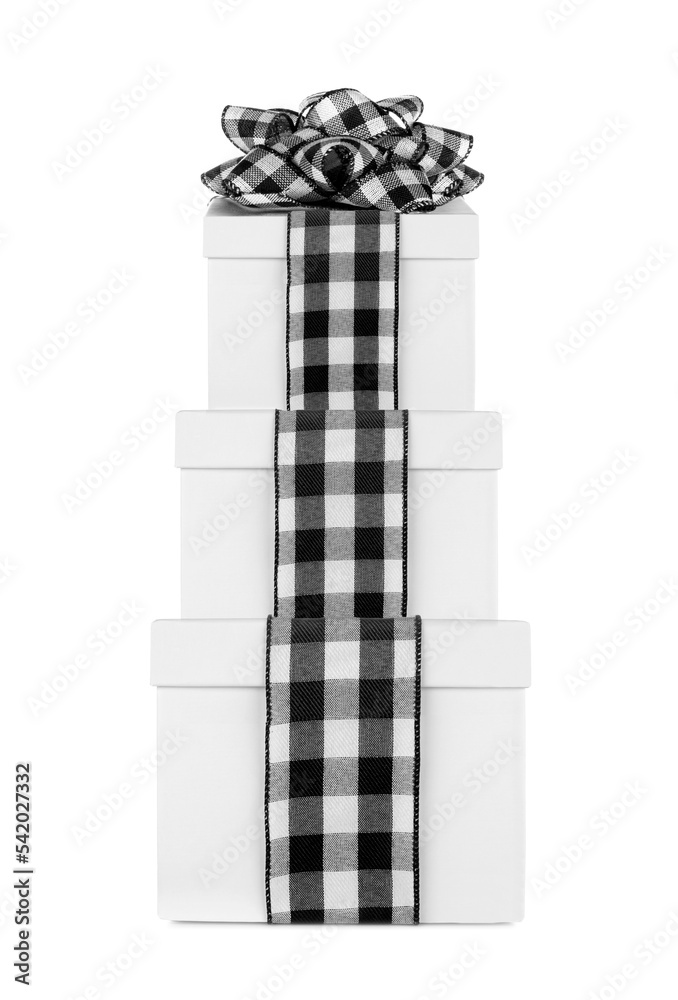 Stacked white Christmas gift boxes with black and white buffalo plaid ...
