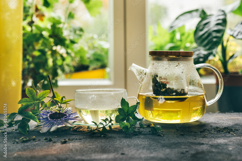 Cup of herbal tea from the leaves of passiflora on rustic background ...