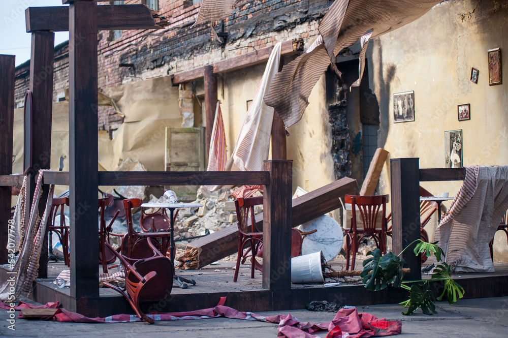 street with buildings damaged after the explosion. street cafe and the ...