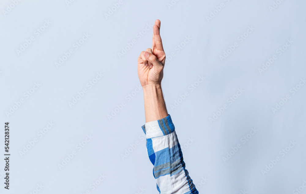 Hand gesturing the letter R in sign language on an isolated background ...