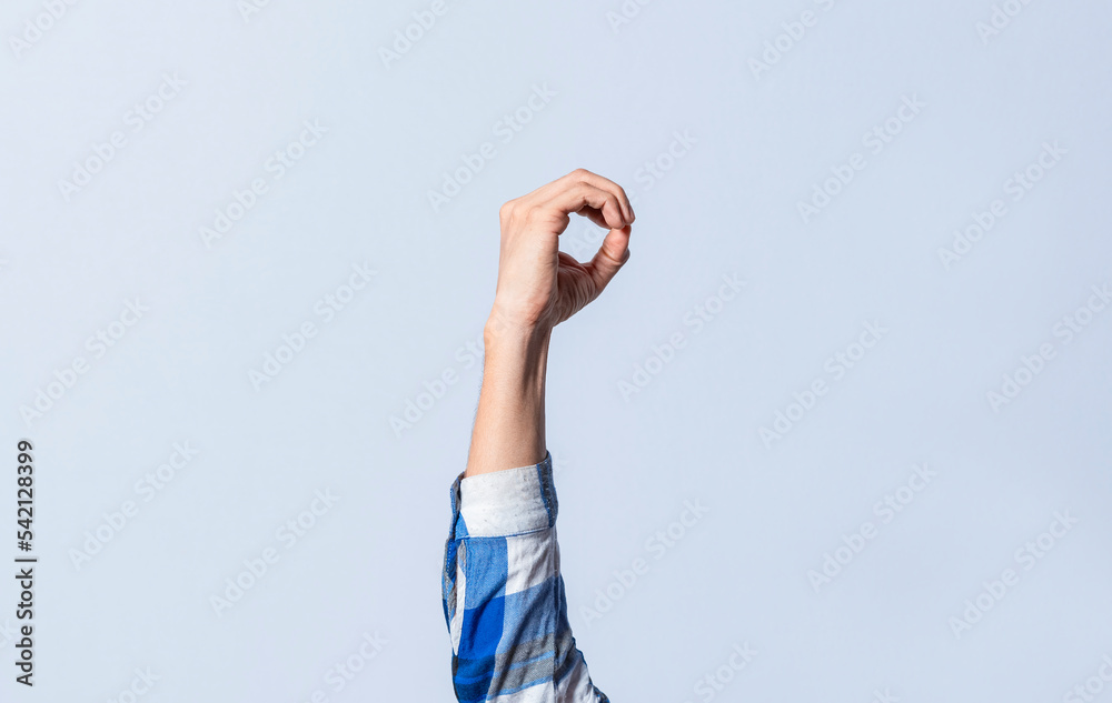 Hand gesturing the letter O in sign language on an isolated background ...