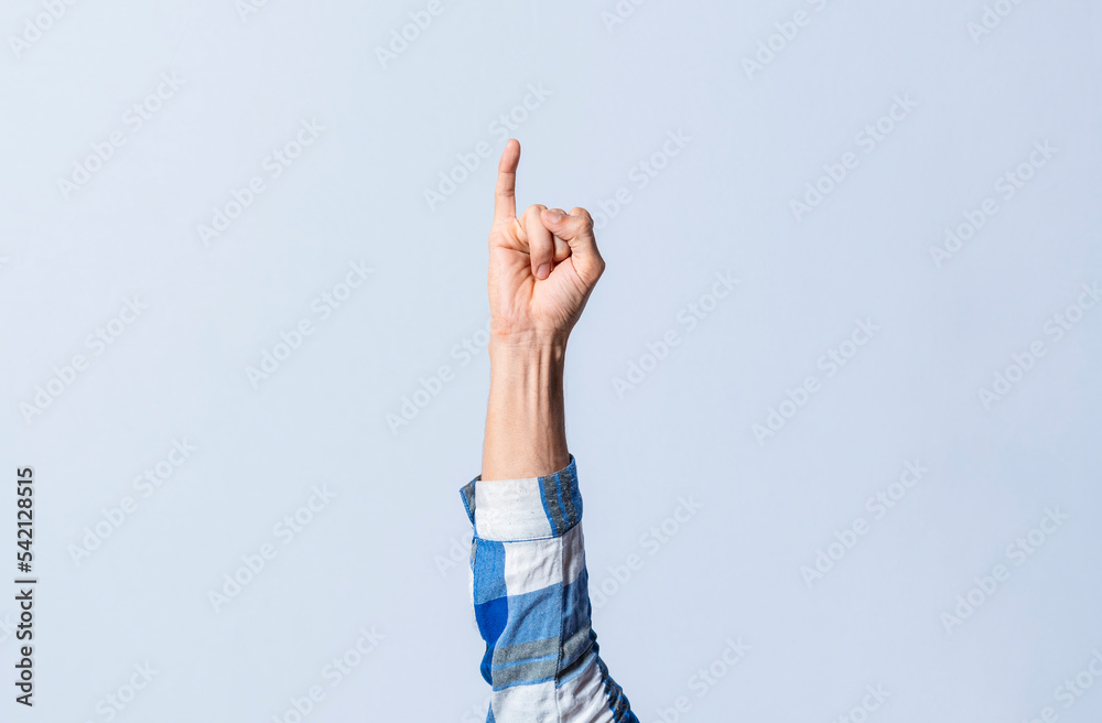 Hand gesturing the letter I in sign language on an isolated background ...