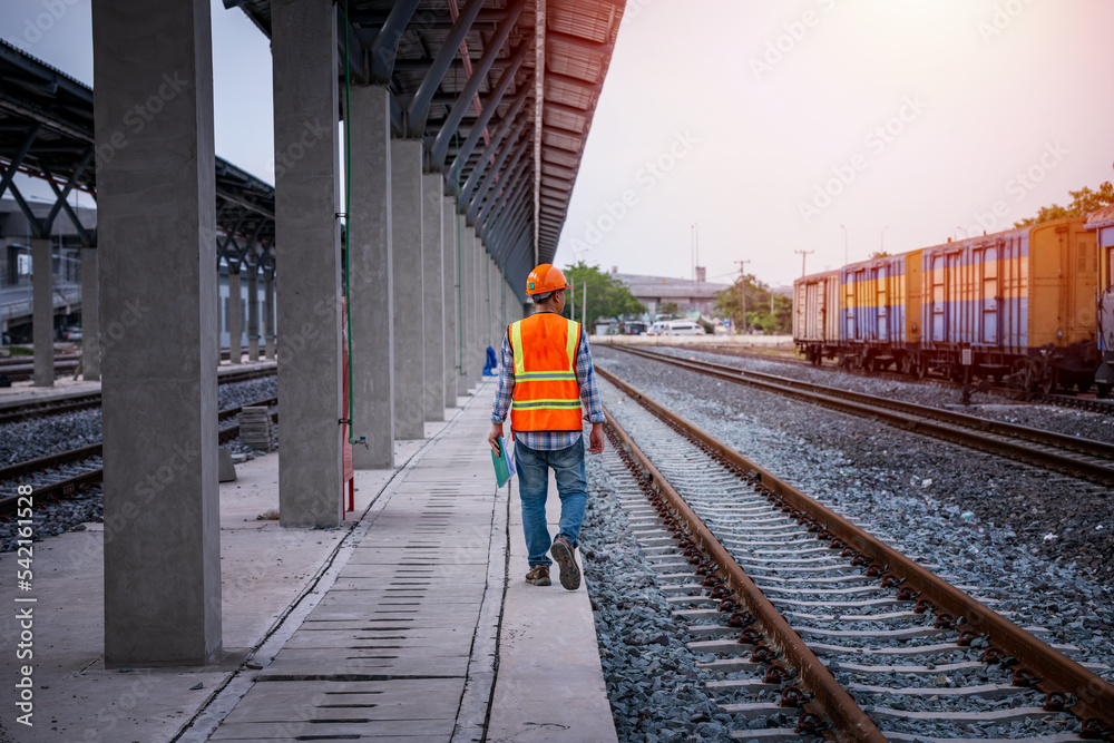 Engineer under inspection and checking construction process railway ...