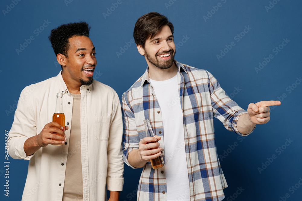 Young two fan friends men wear casual shirts together cheer up support ...