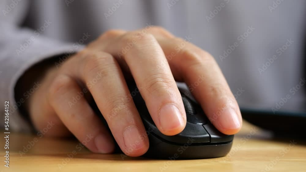 Close-up hand clicking mouse for working using laptops. Internet ...