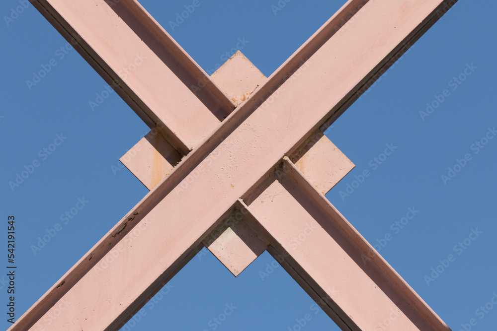 An x-shaped steel plates located between the rope attachment points of ...