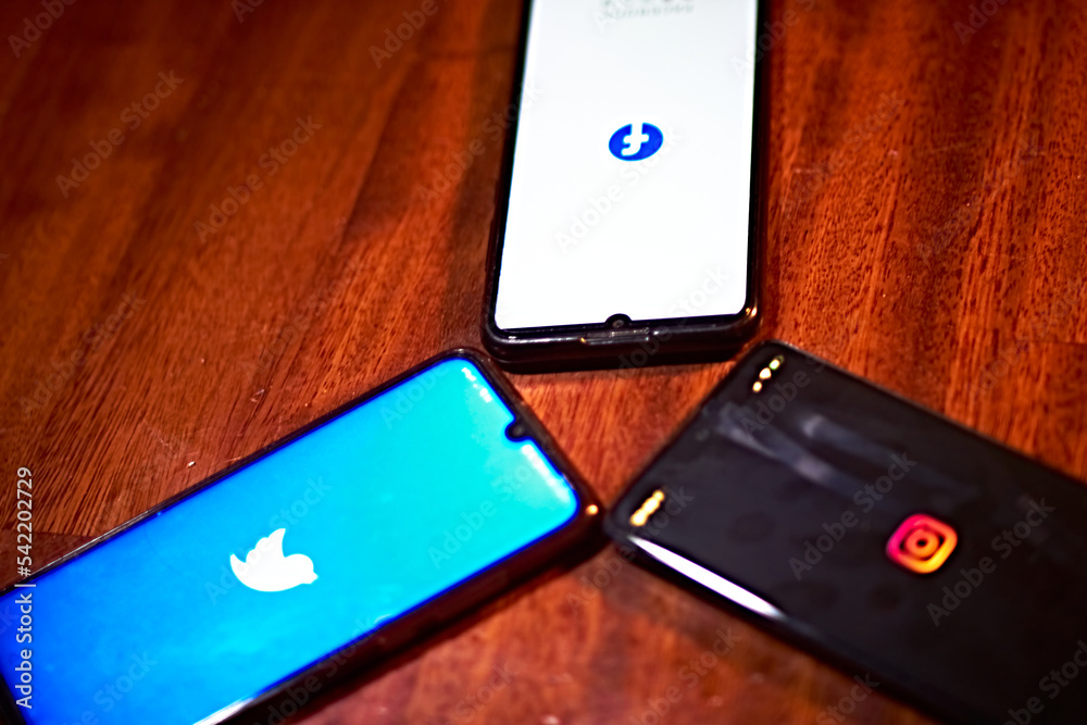 Multiple smart android phones with icons for social media, social ...