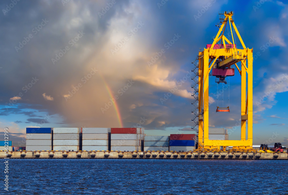Cargo seaport. Sea pier with containers. Yellow cargo crane on seashore ...