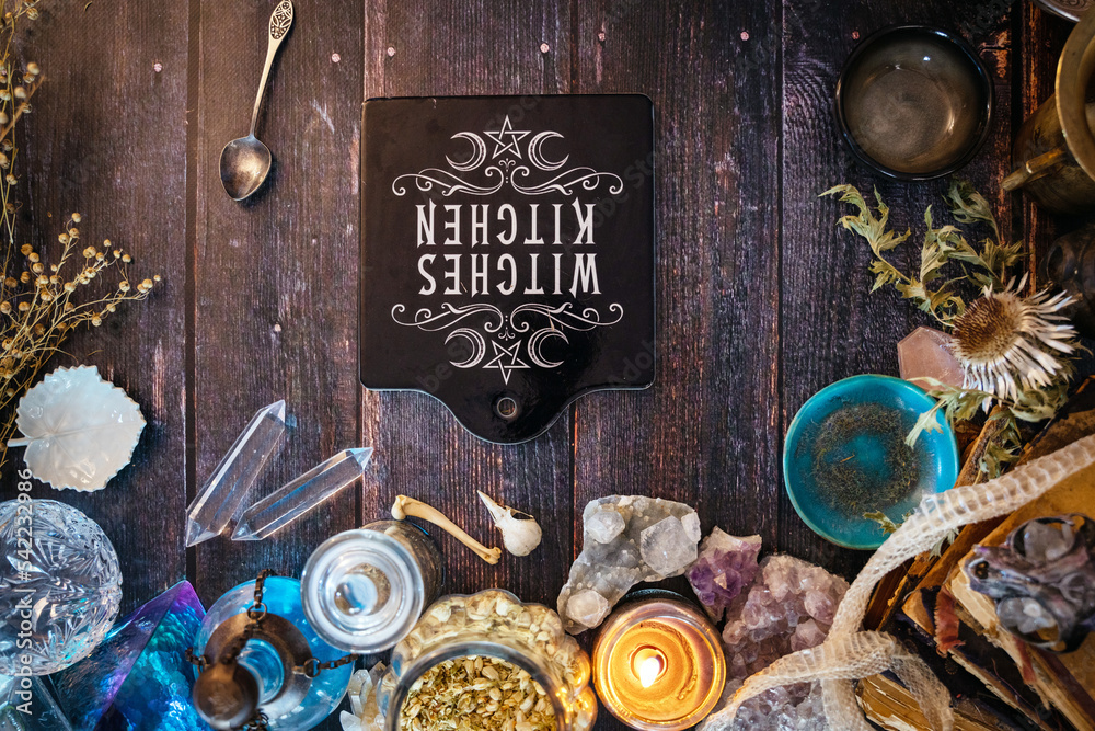 Occult altar background with cristals, herbs and old books. Esoteric ...