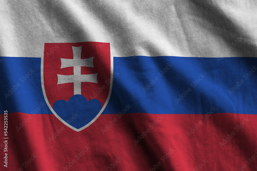 Slovakia flag with big folds waving close up under the studio light ...