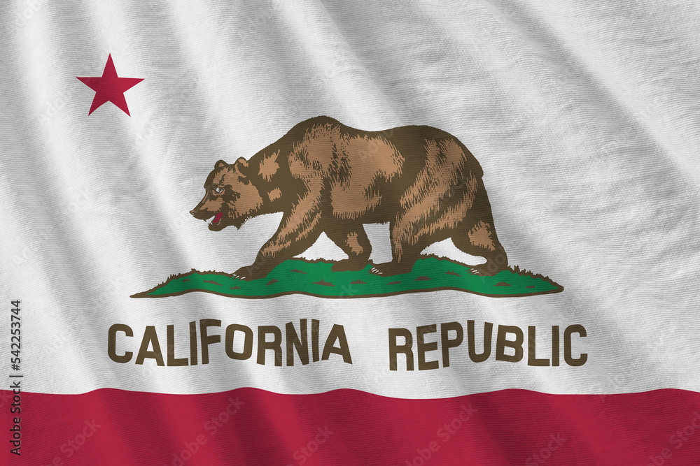 California US state flag with big folds waving close up under the ...