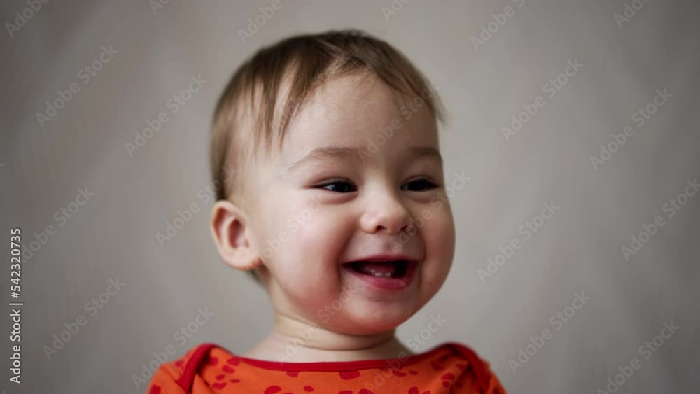 Happy cute little toddler laughing cheerfully with toothless smile ...