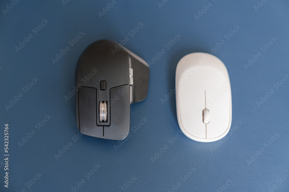 Comparison of Ergonomic vertical mouse and general mouse on desk at ...