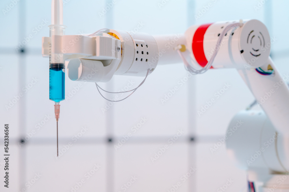 Robot hand with a medical syringe. Future medicine concept using robots ...
