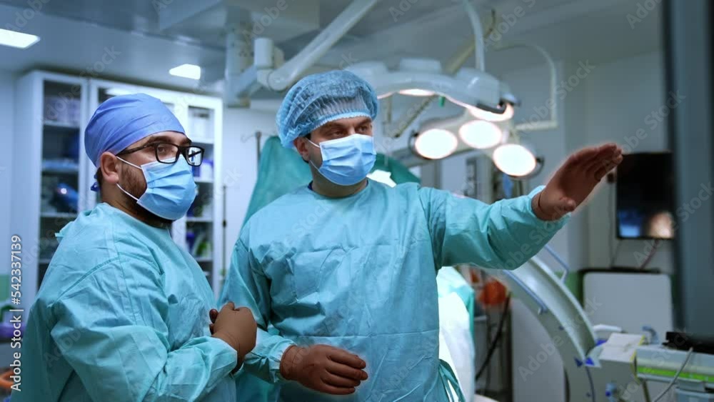 Surgery teamwork specialists. Modern professional surgeons in masks and ...