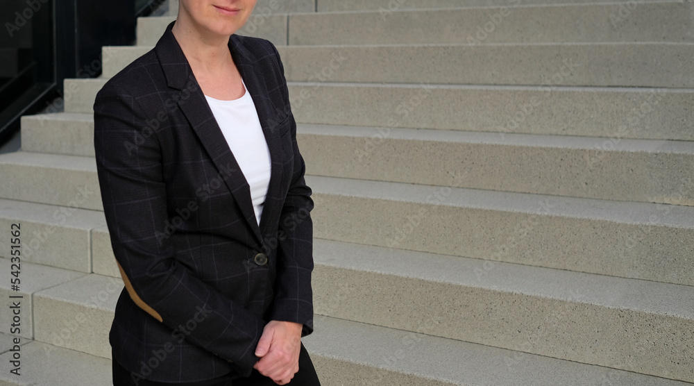 Female professional in a white shirt and black suit jacket with an ...