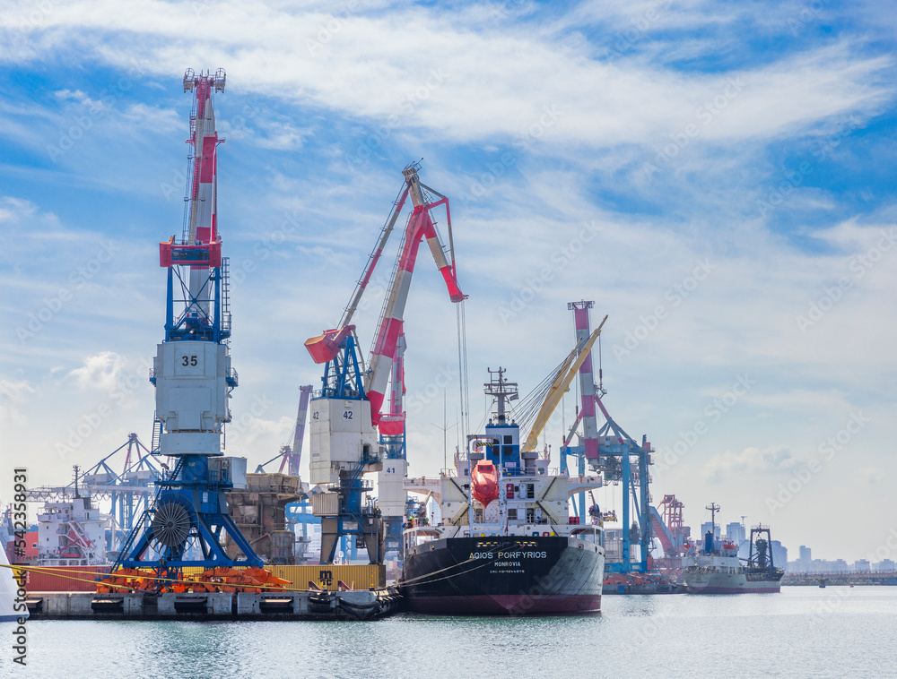 Shipping containers being unloaded at port facilities in Ashdod, Israel ...