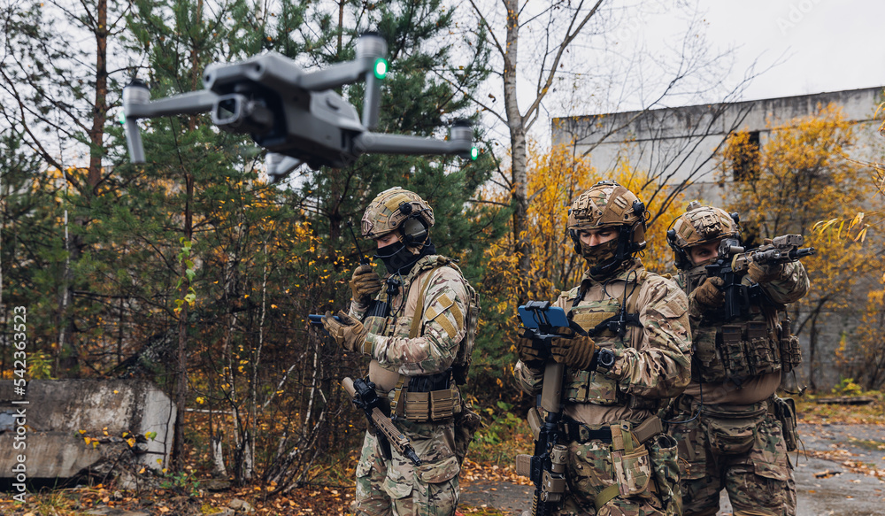 Modern soldiers group. Concept army using aerial drone scouting view ...