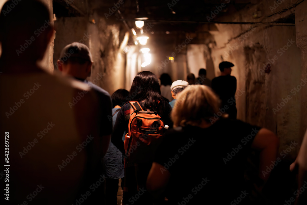 People in an underground tunnel. People go into an underground tunnel ...