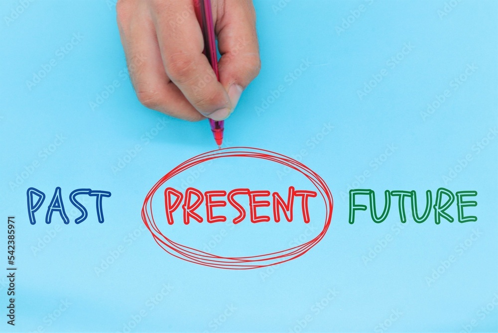 hand with red pen pointing or indicating the text where the present ...