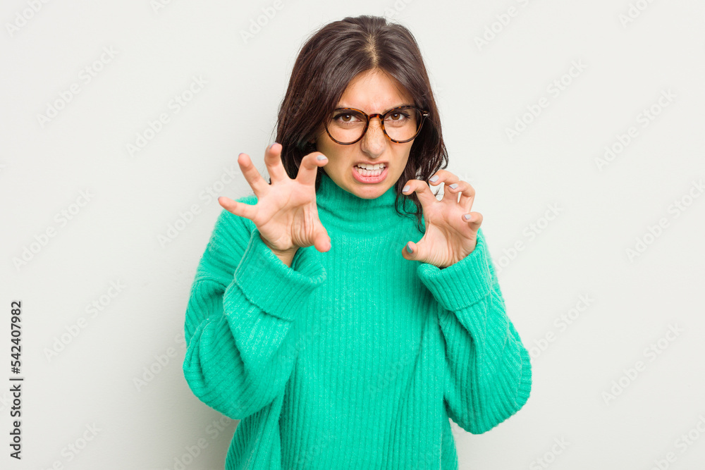 Young Indian woman isolated on white background showing claws imitating ...