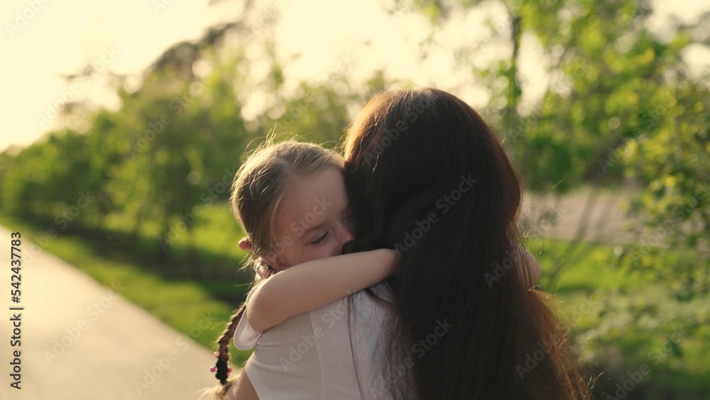 little child runs hug his mother. happy family. mom daughter child ...