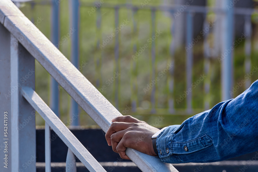 Moving along a premeditated route, a dark skinned man in jeans will ...