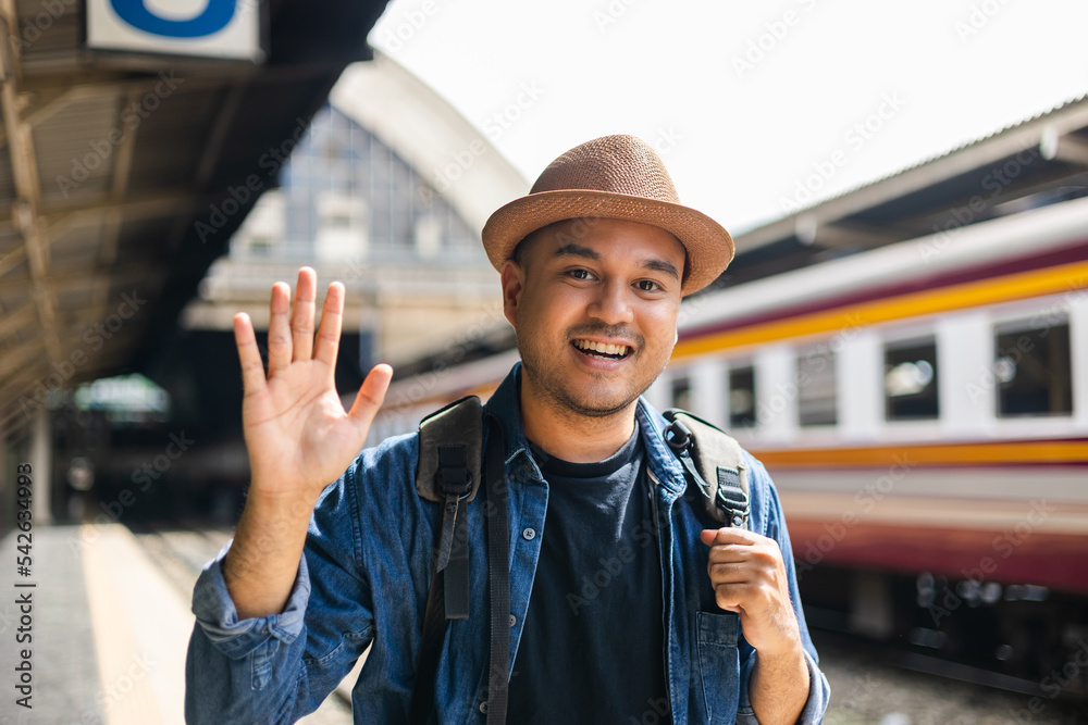 Freedom traveler young asian man at terminal train station. Happy ...