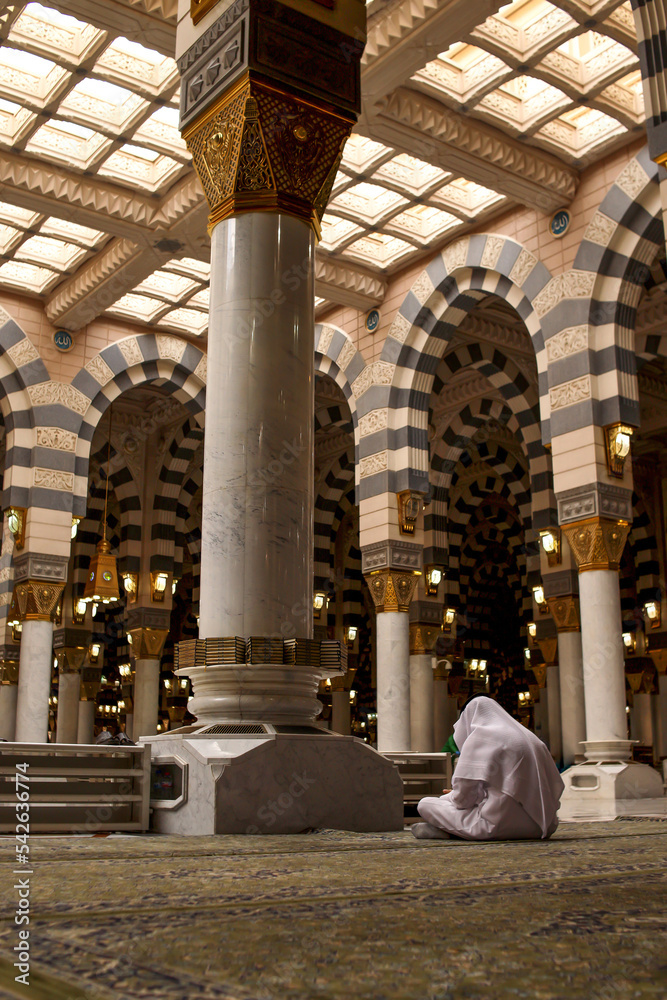 Muslims praying inside Nabawi Mosque. Interior view of Masjidil Nabawi ...