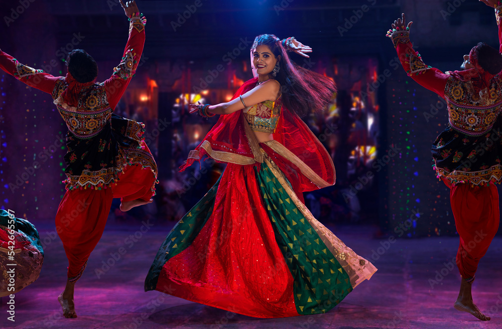 Gujrati woman performing Garba on stage Stock Photo | Adobe Stock