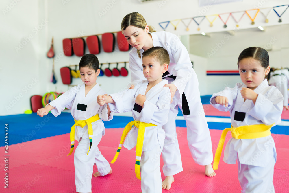Active kids practicing karate with a martial arts trainer Stock Photo ...