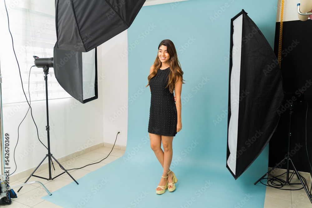 Beautiful female professional model during a photo shoot in a studio ...