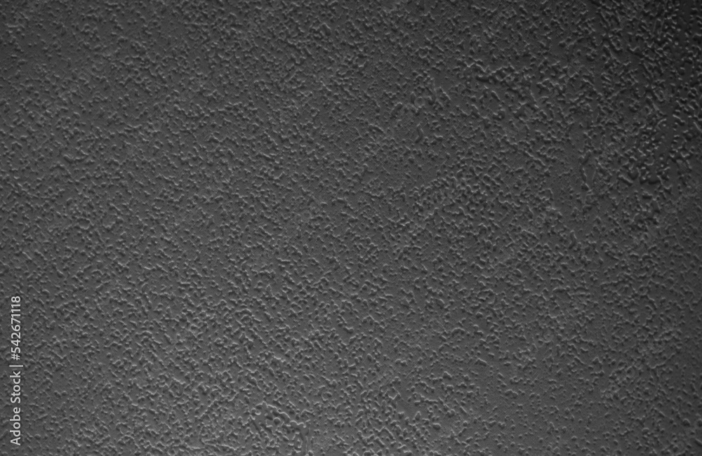 Dark background of decorative plaster with abstract spots. Unusual ...