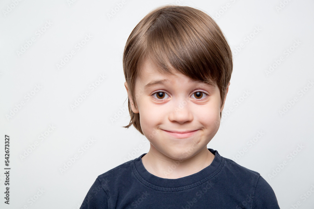 Portrait of a smiling child in good mood close-up isolated on a white ...