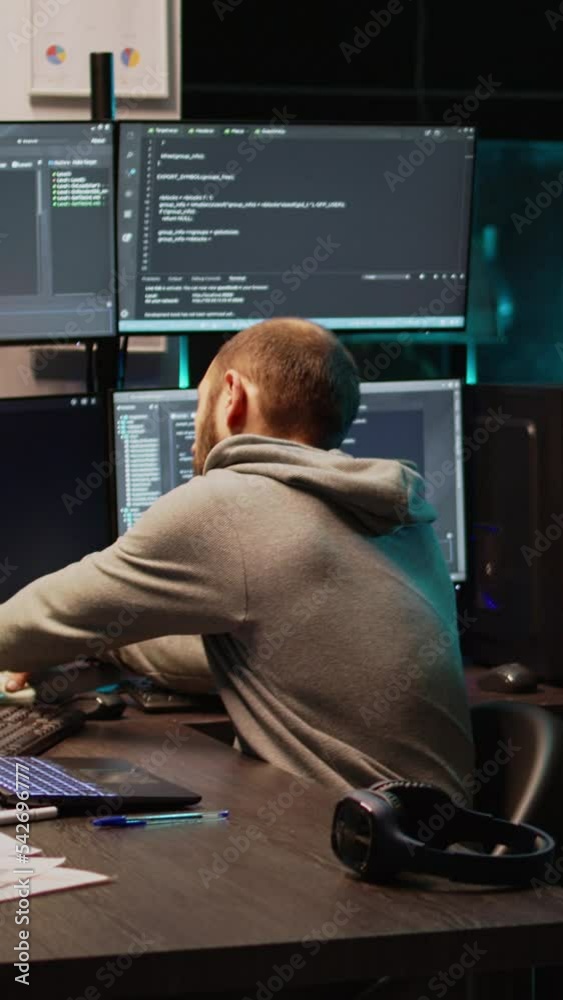 Vertical video: Male app developer answering landline phone call late at night, talking on ...